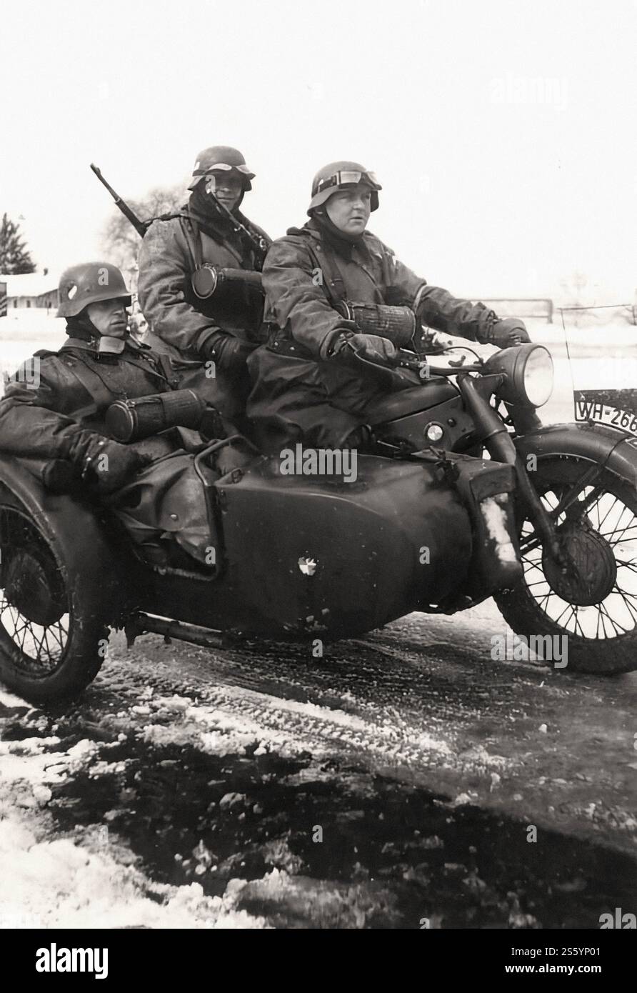 Crew of German soldiers on an heavy motorcycle R-12, manufactured by ...
