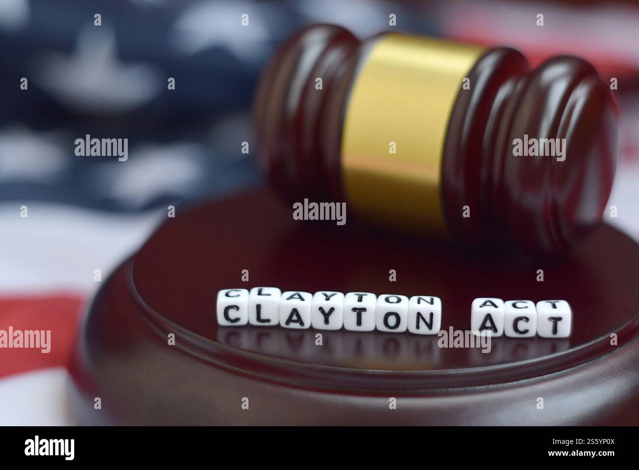 Justice mallet and Clayton act characters close up with US flag on ...