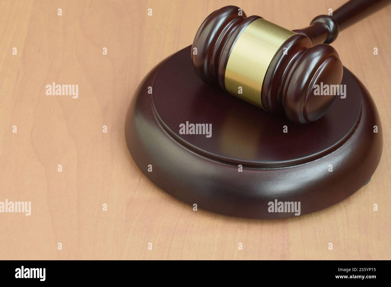 Justice mallet on wooden desk in a courtroom during a judicial trial. Law concept and empty copy ...