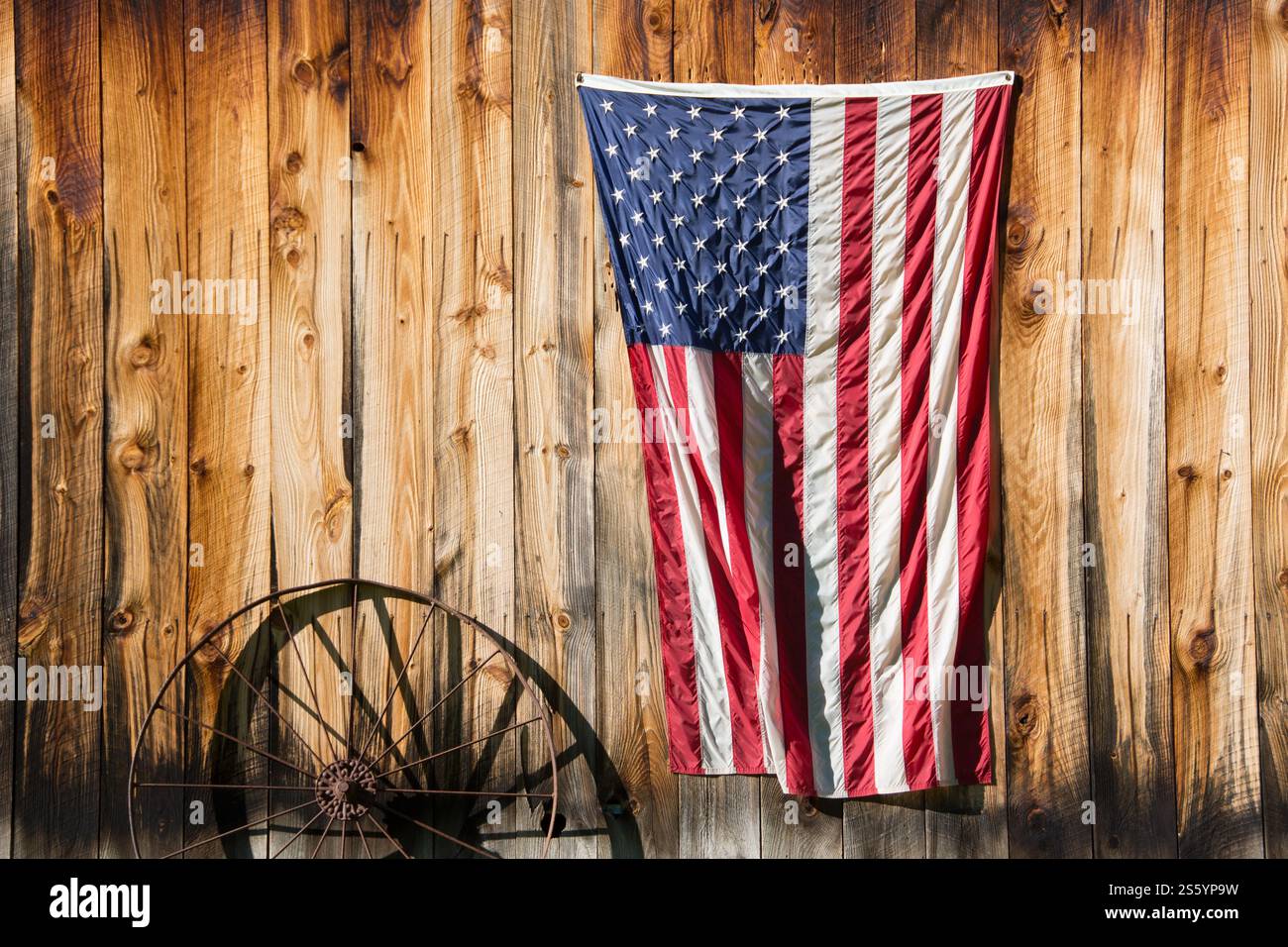 American Flag on barn with wagon wheel, Lenox, Massachusets Stock Photo ...