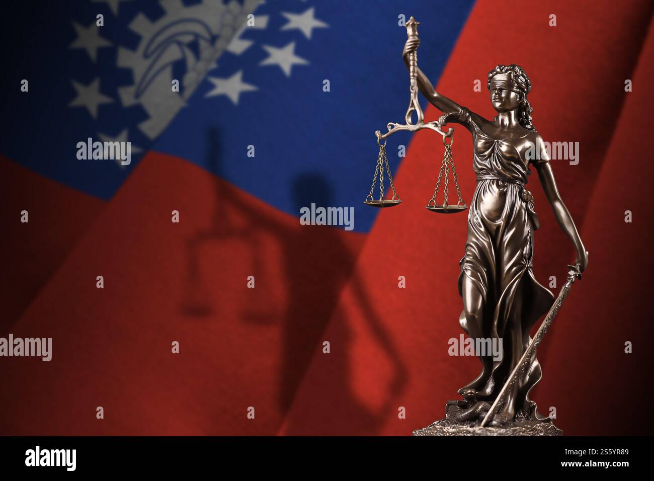 Myanmar flag with statue of lady justice and judicial scales in dark ...