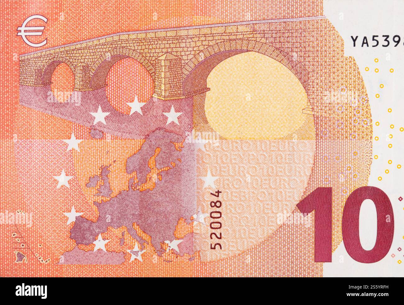 Fragment part of 10 euro banknote close-up with small red details ...