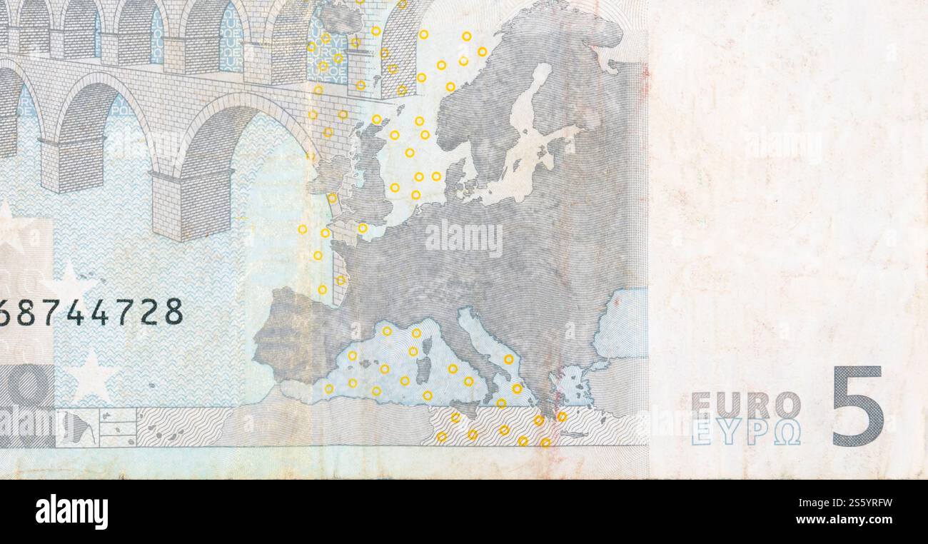 Fragment part of 5 euro banknote close-up with small brown details ...