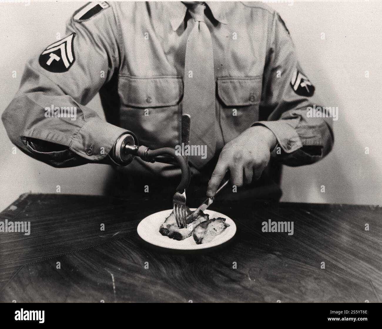 Medicine in Wartime - Man with A Prosthetic Right Arm Sits At A Table ...