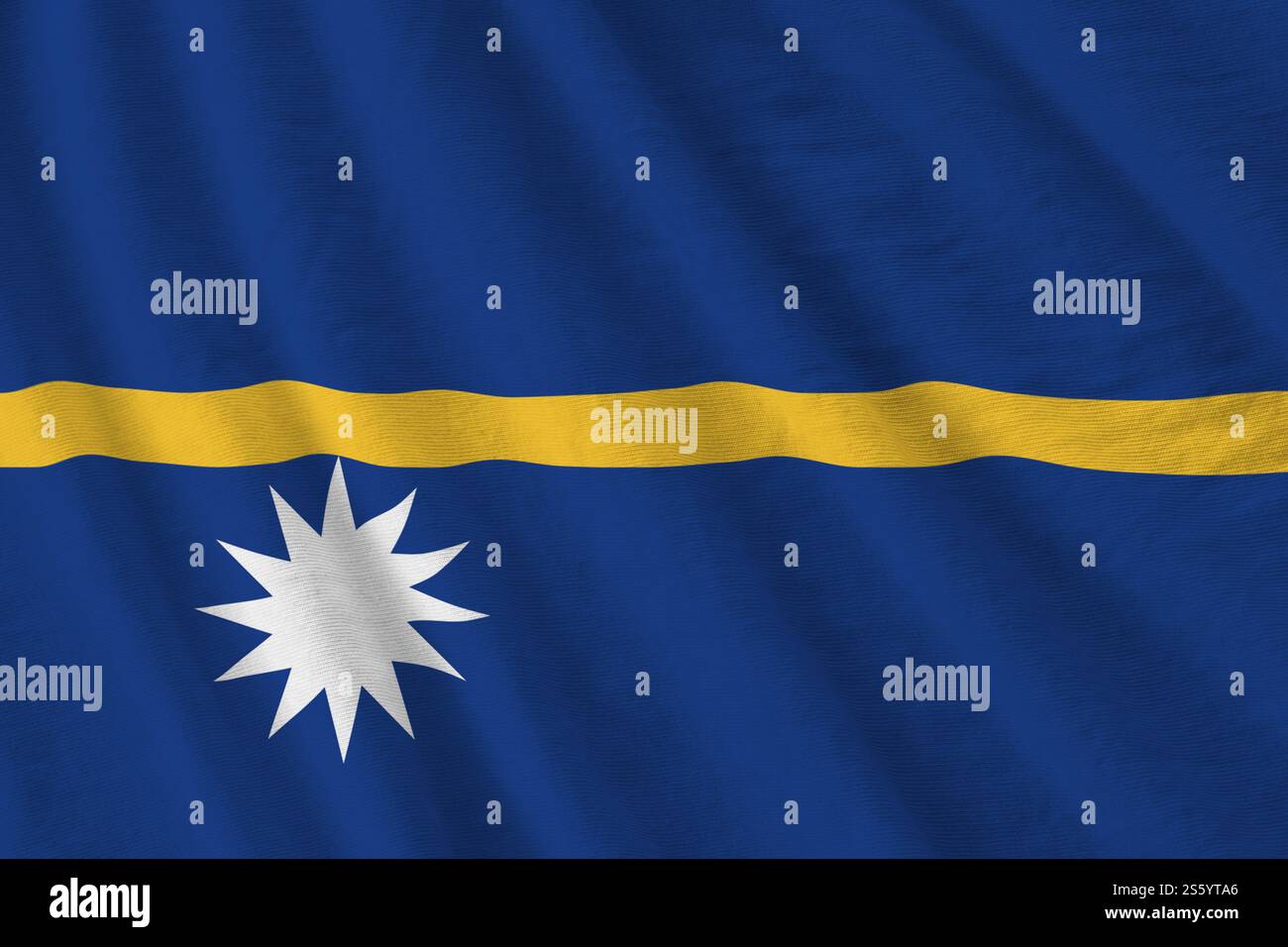 Nauru flag with big folds waving close up under the studio light ...
