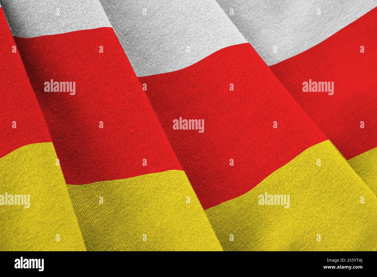 South Ossetia flag with big folds waving close up under the studio ...
