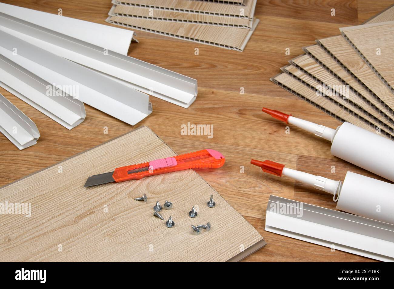 Set of items for PVC ceiling indoor works. Assembly adhesive bottles ...