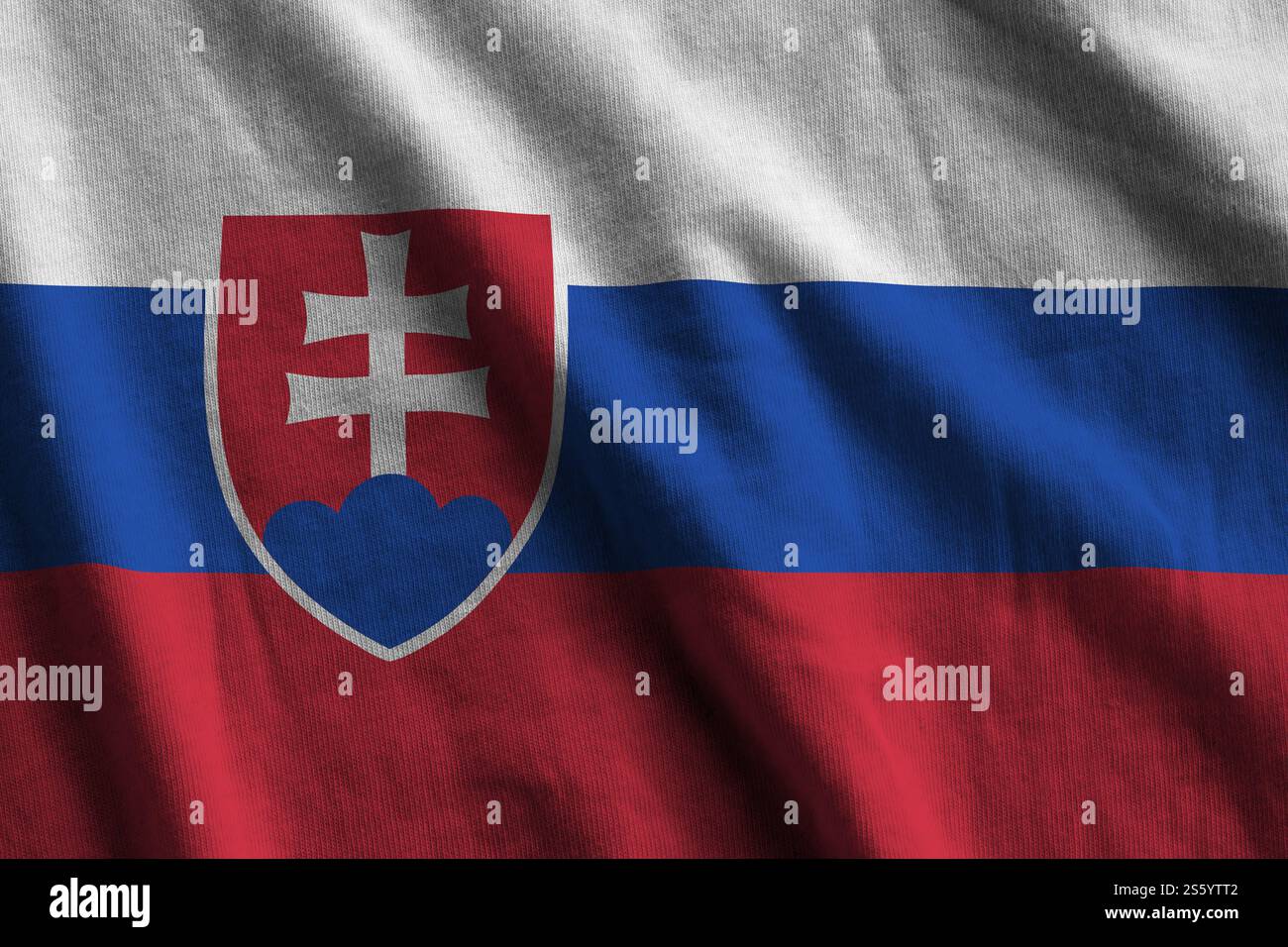 Slovakia flag with big folds waving close up under the studio light ...