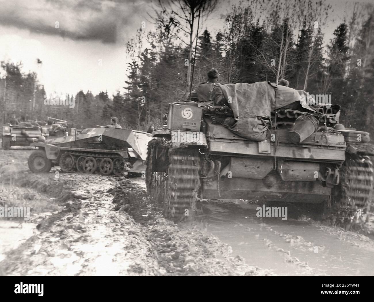 Crew of German soldiers on an armored vehicle StuG III and Sd.Kfz. 253 ...