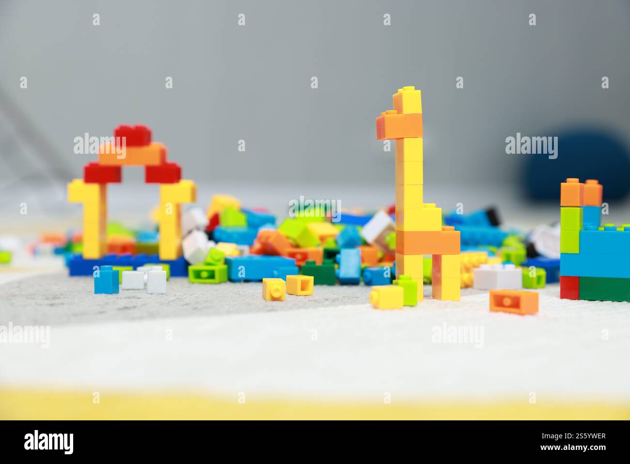 Construction toy. Figures made with building bricks and colorful blocks ...