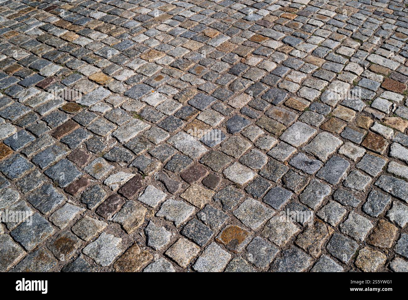 Background of bricks road. Background with bricks road. Stone cladding ...
