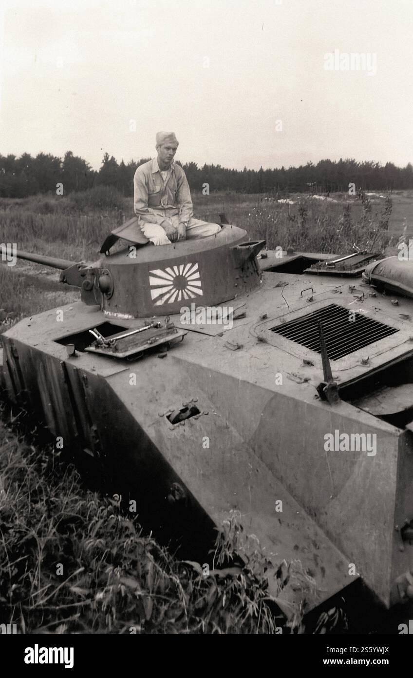 American officer on abandoned Japanese amphibious tank type 2 in ...
