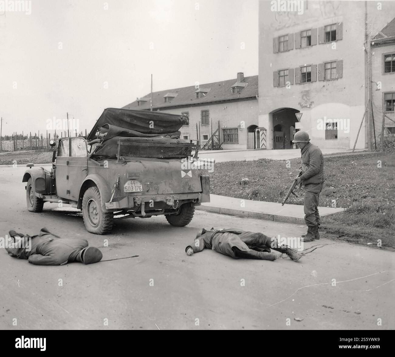 American soldiers have shot the German staff car and the bodies of dead ...