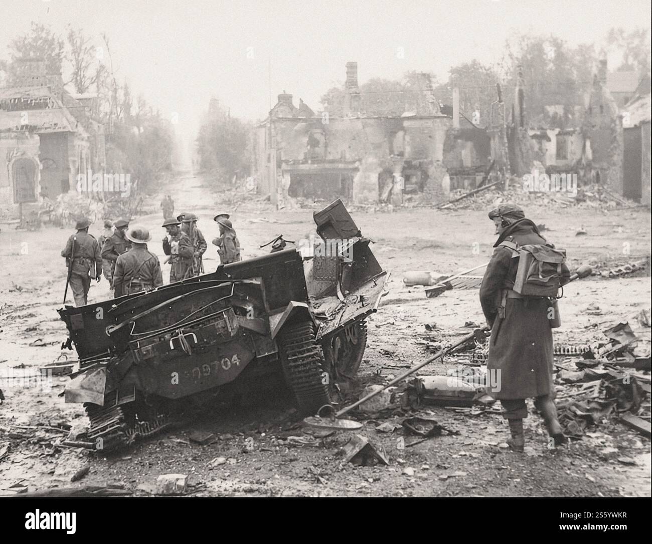 British sapper with a mine detector at an armored personnel carrier hit ...