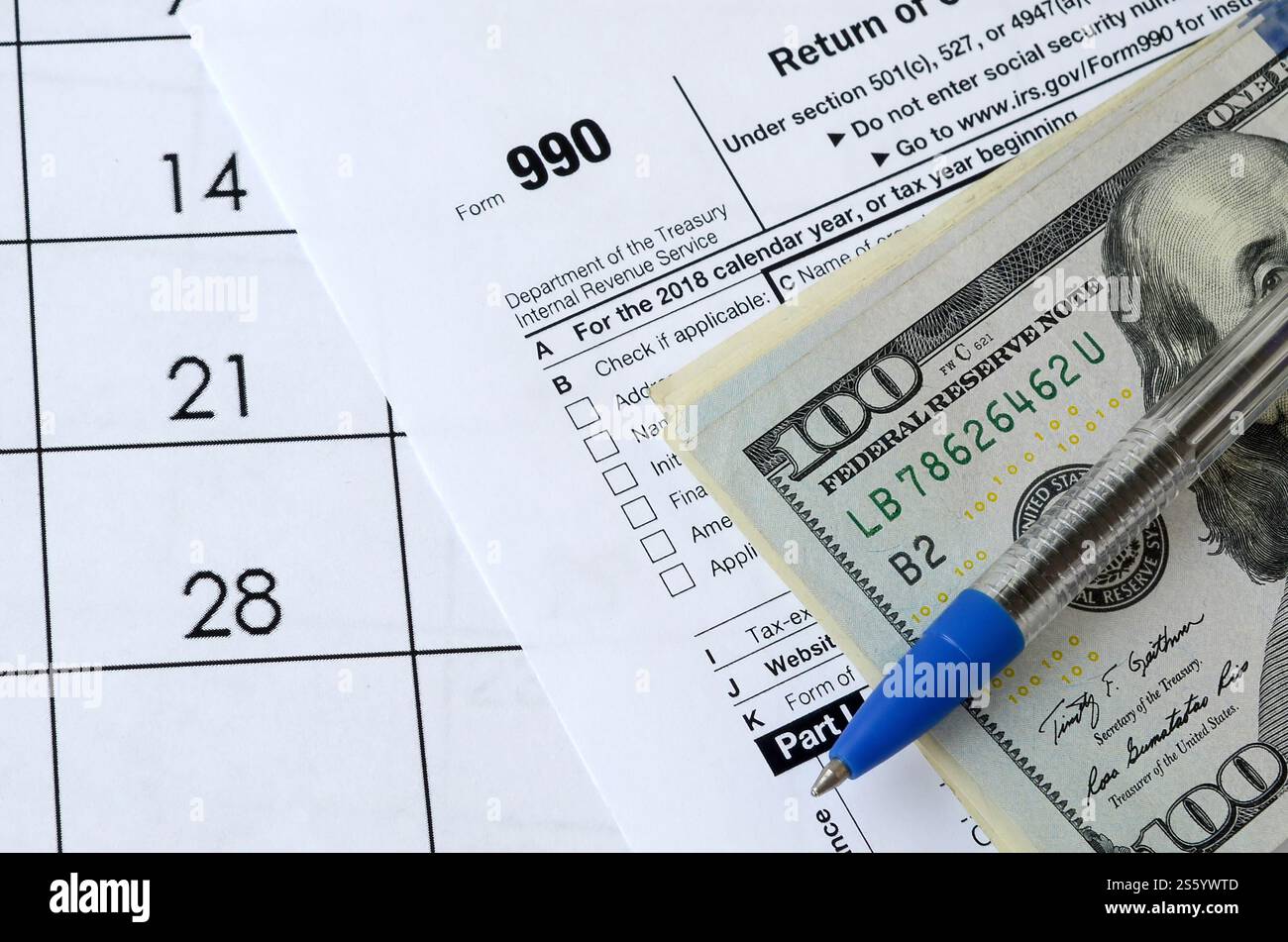 Form 990 Return of organization exempt from income tax and blue pen ...