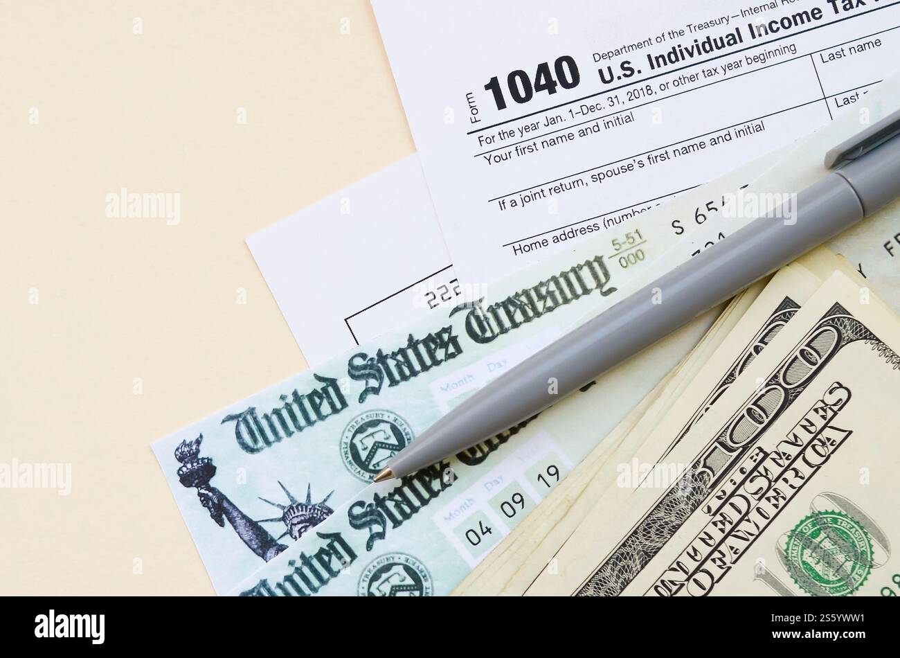 1040 Individual Income tax return form with Refund Check and hundred ...