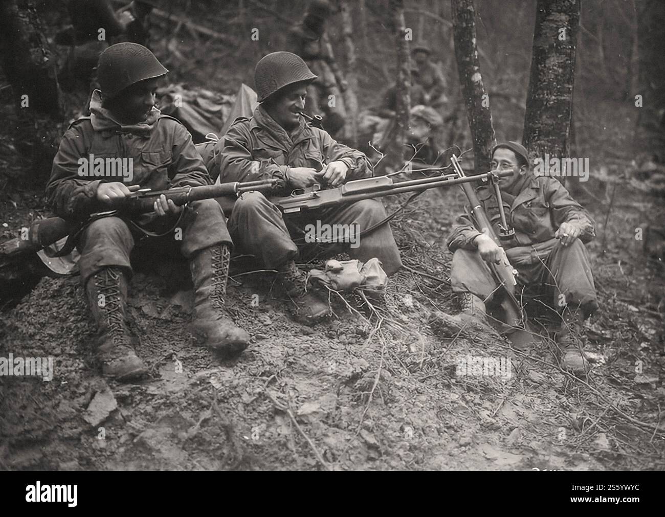 GIs of the 75th Infantry Division, cleaning their M1 Garands and ...