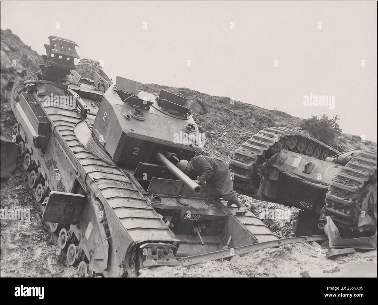 Italian soldier inspects abandoned tanks - Churchill» (Churchill) in ...