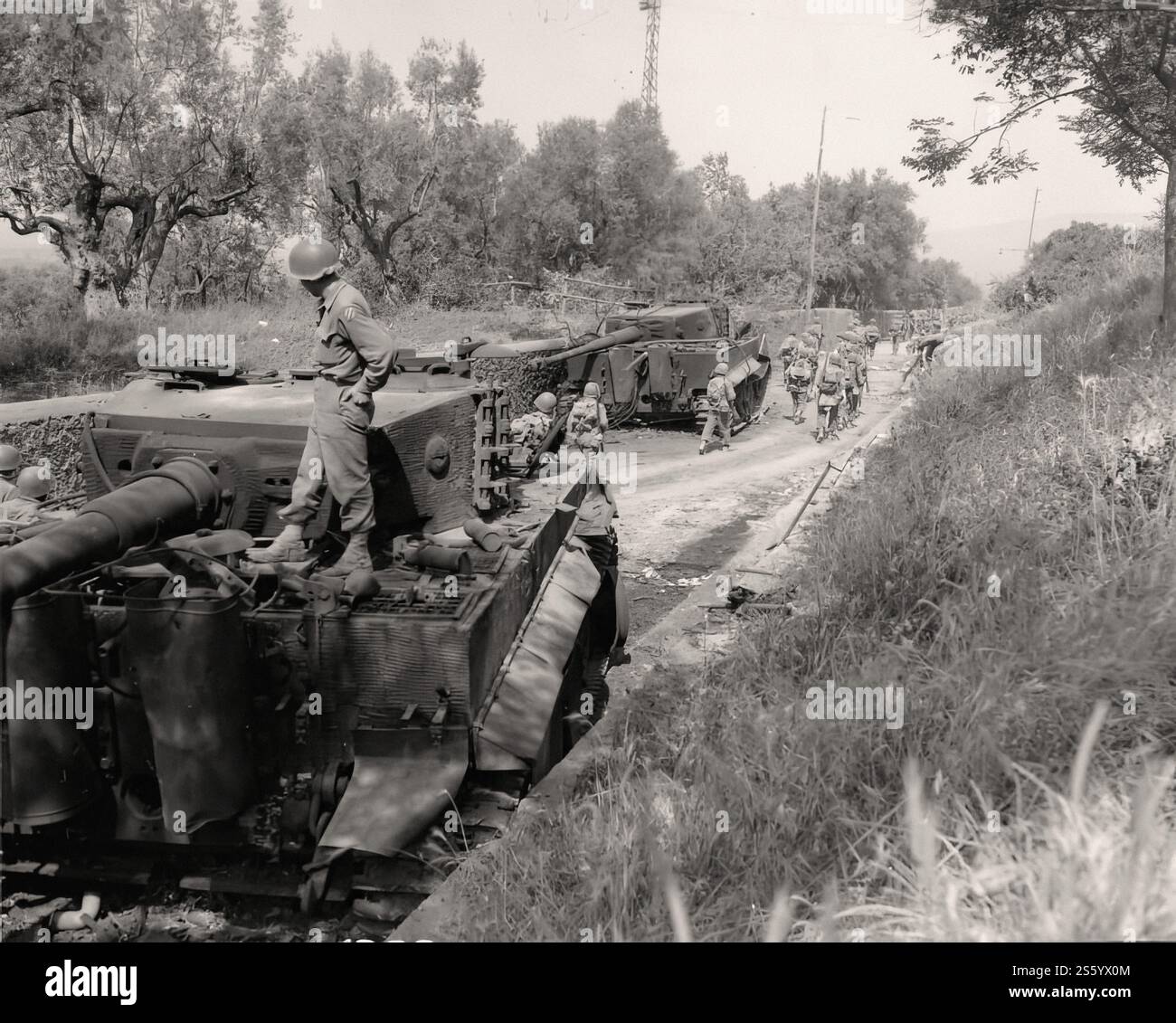GIs of the 3rd Infantry Division, United States examines burned-out ...