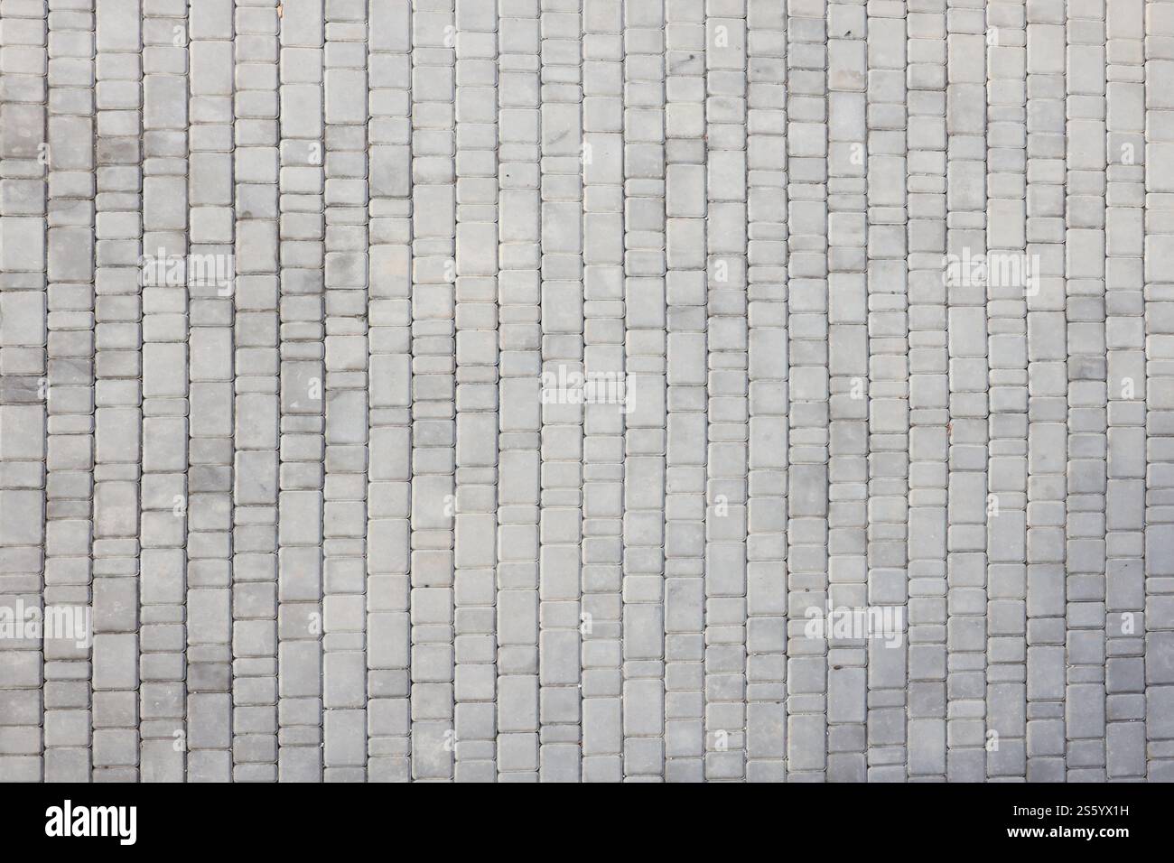 Gray color paving slabs in the pedestrian street sidewalk. Rough ...