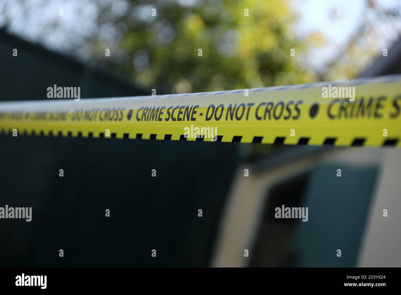 Crime scene tape for covering the area cordon. Yellow tape with blurred ...