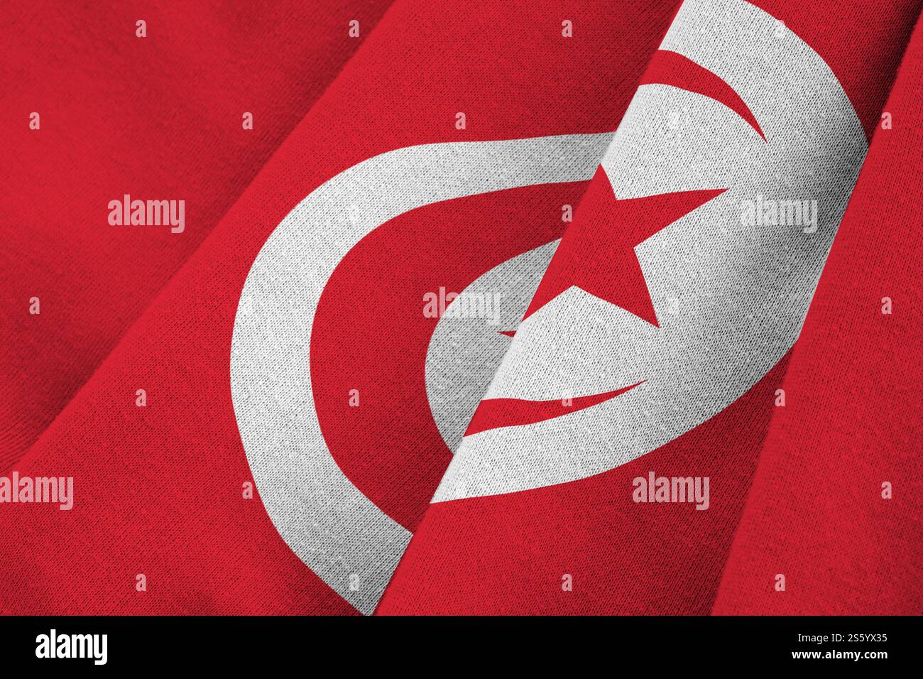 Tunisia flag with big folds waving close up under the studio light ...