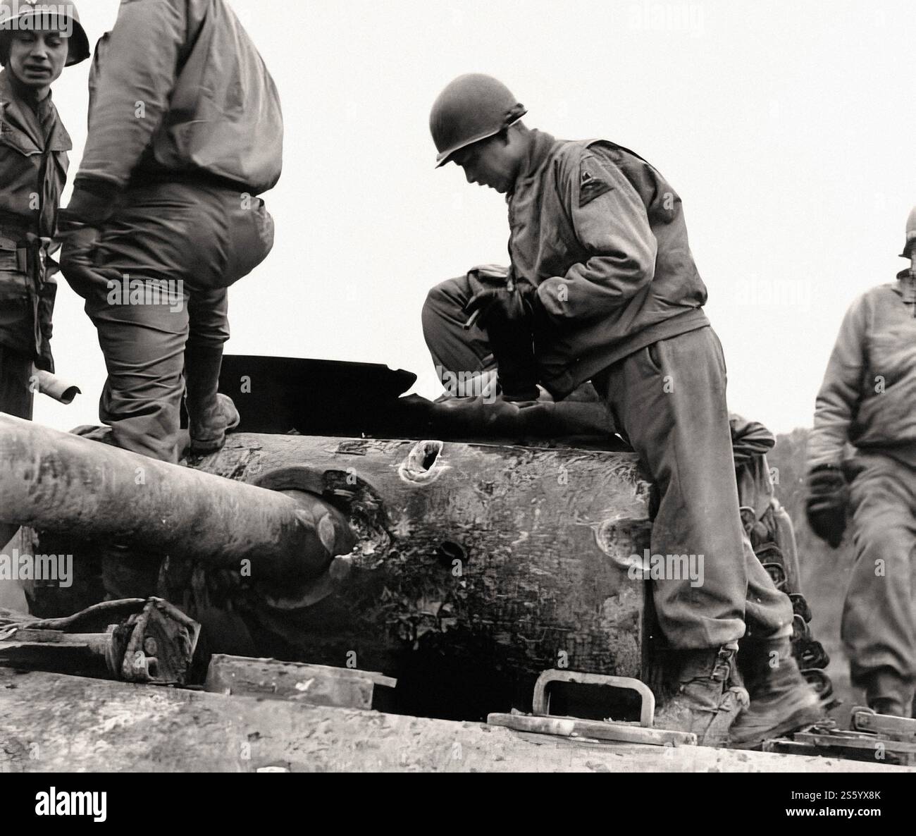 American soldier inspecting an abandoned german tank - Historical ...