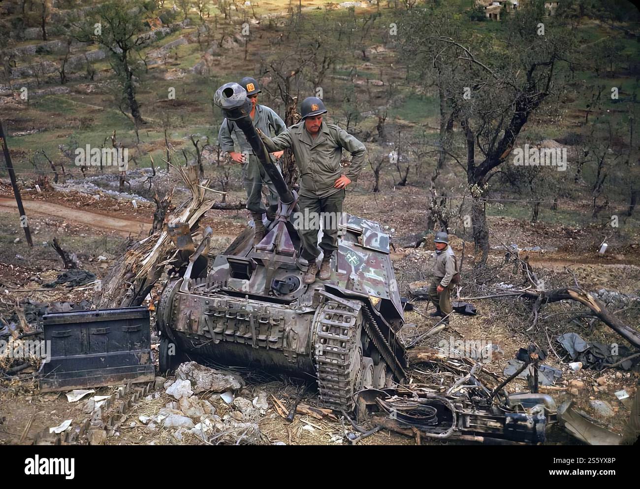 U.S. soldiers inspecting a German SPG Marder III taken off the road to ...