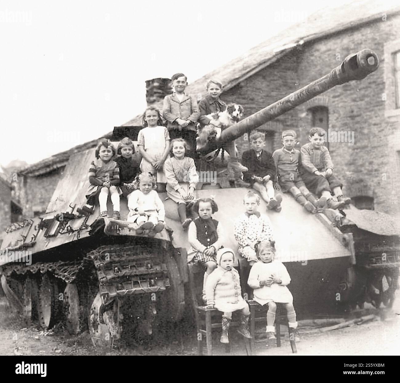 Smiling kids posing on a Tiger tank - Historical document, photographer ...