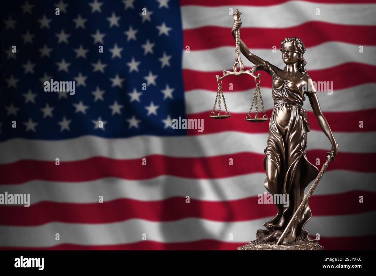 United States of America flag with statue of lady justice and judicial ...