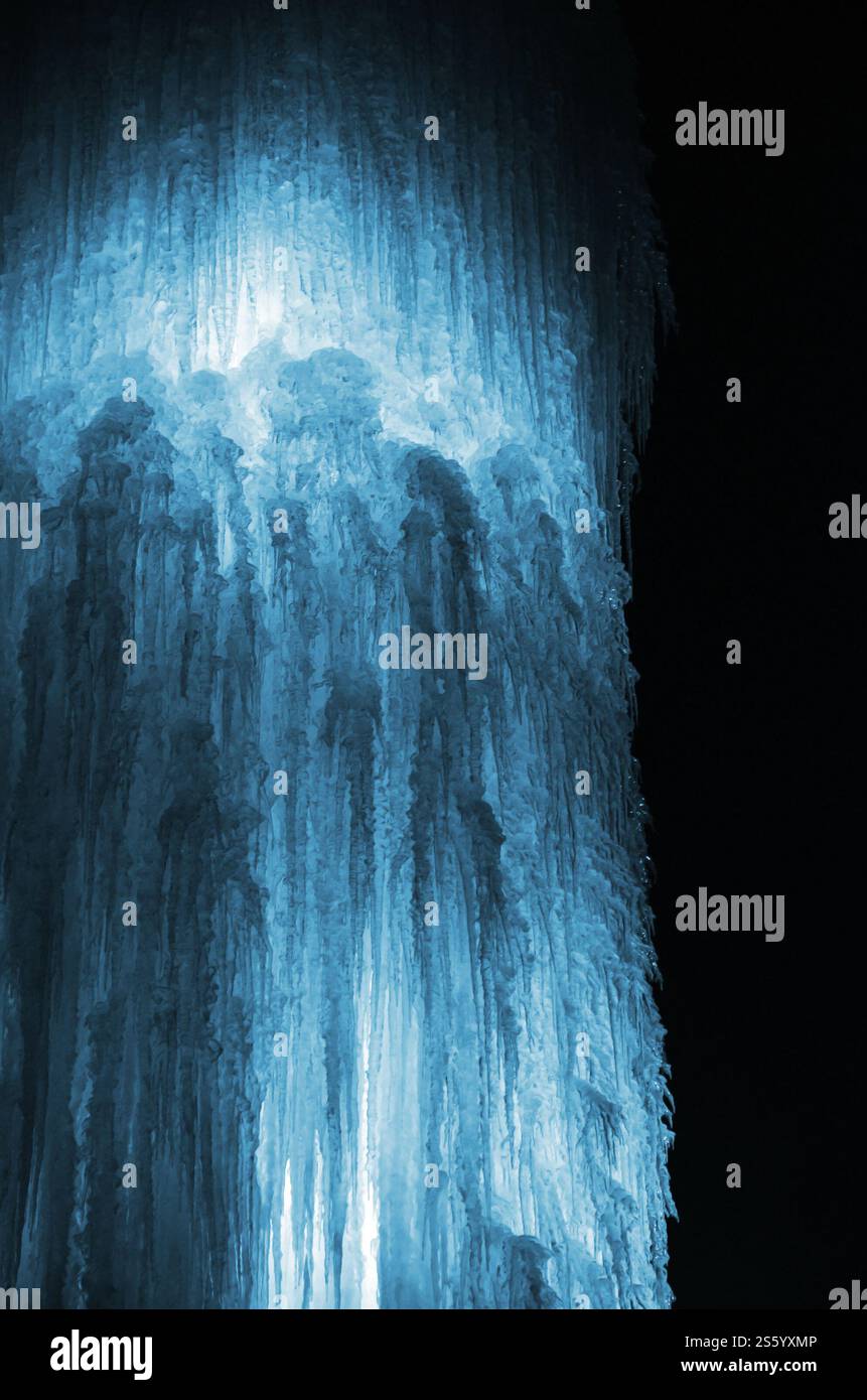 Huge ice icicles. Large blocks of ice frozen waterfall or water. Blue ...