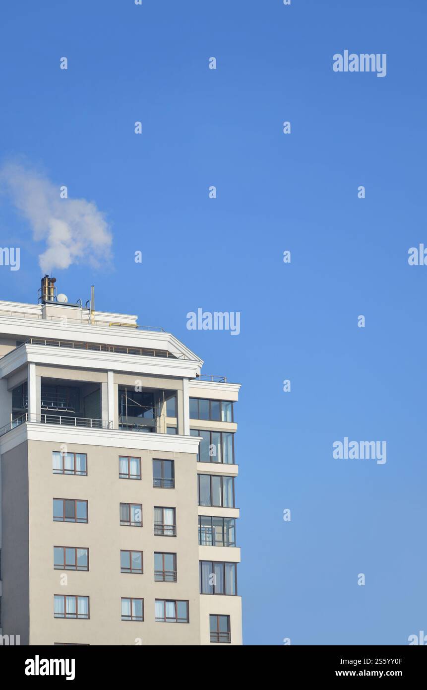 Multi-story office building beige color with lots of glass windows on a ...