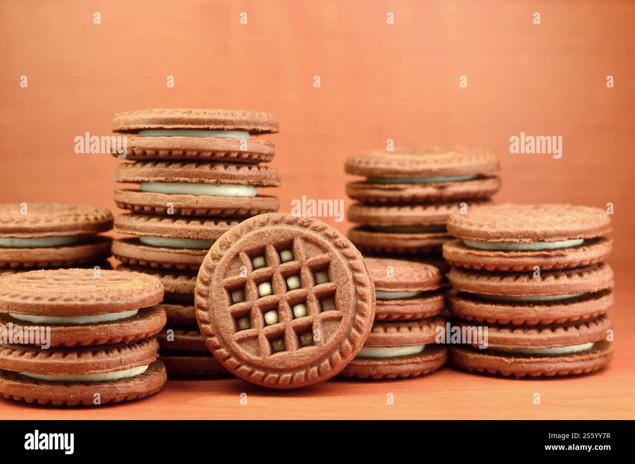 Chocolate sandwich round biscuits with vanilla cream filling on brown ...