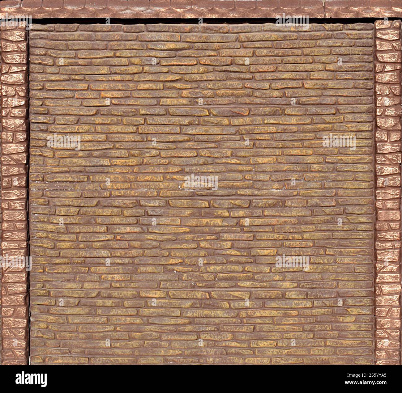 Fence texture of elongated colored stones in warm colors. Weathered ...