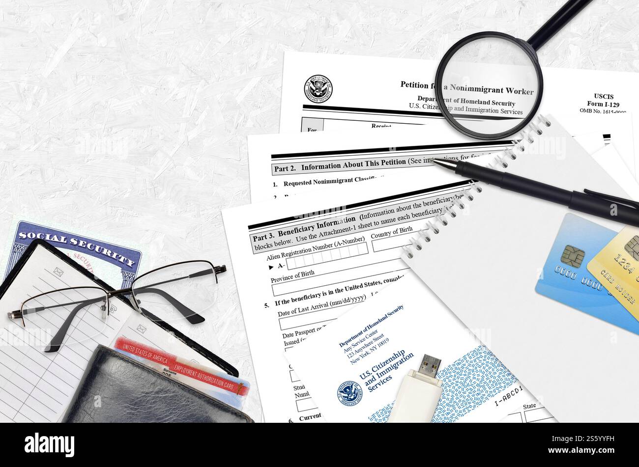 USCIS form I-129 Petition for a nonimmigrant worker lies on flat lay ...