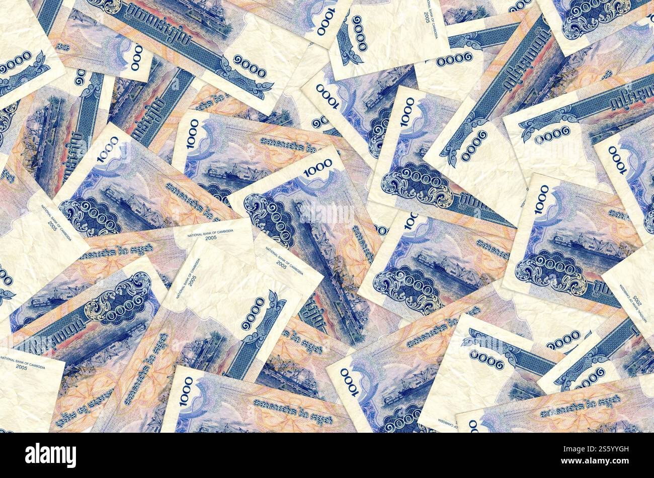 1000 Cambodian riels bills lies in big pile. Rich life conceptual ...