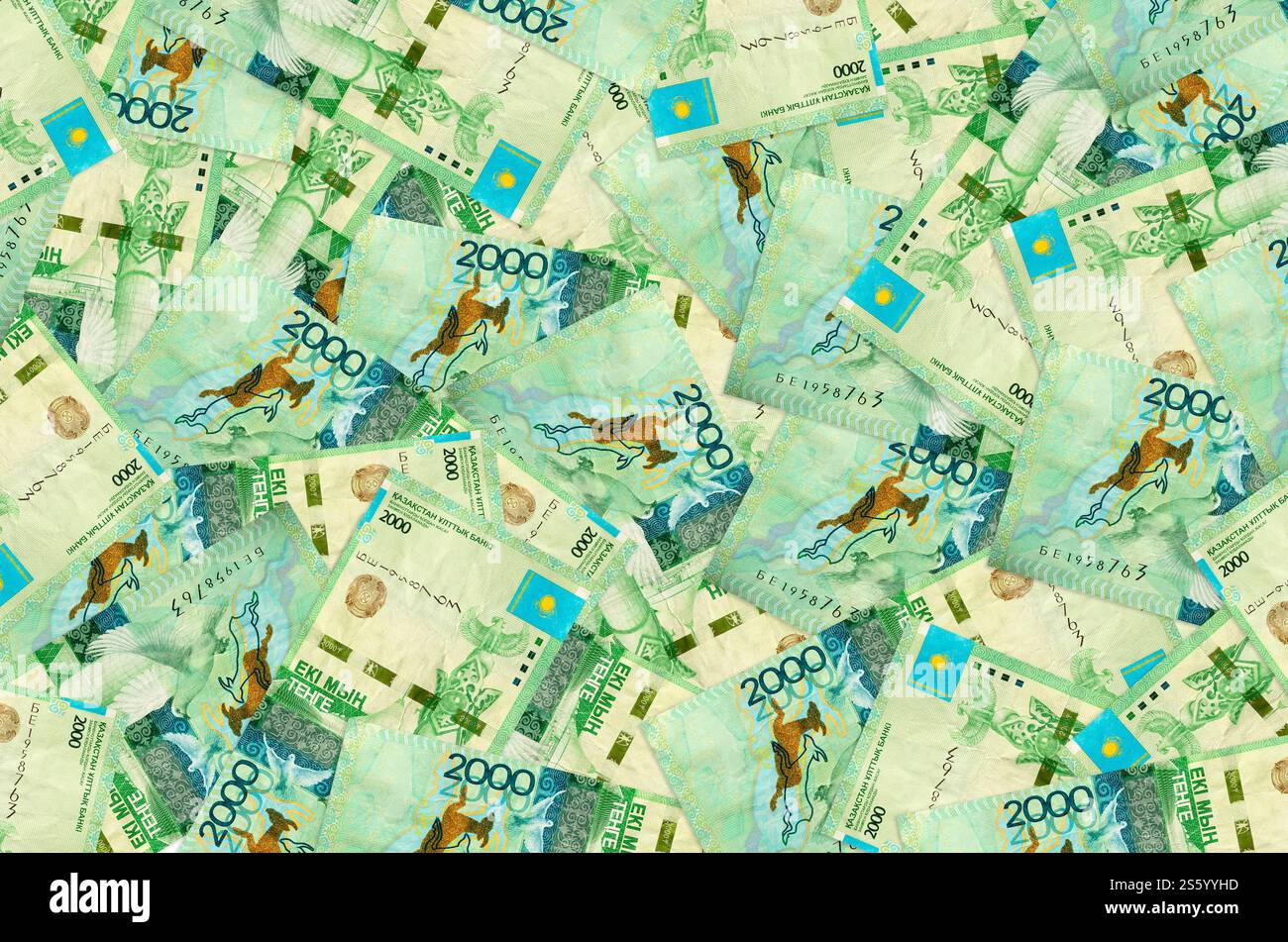 2000 Kazakhstani tenge bills lies in big pile. Rich life conceptual ...