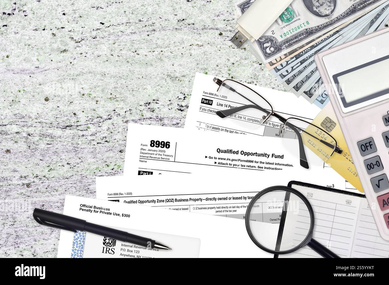 IRS form 8996 Qualified opportunity fund lies on flat lay office table ...