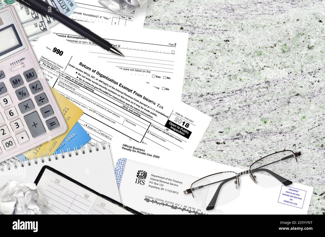 IRS form 990 Return of organization exempt from income tax lies on flat ...