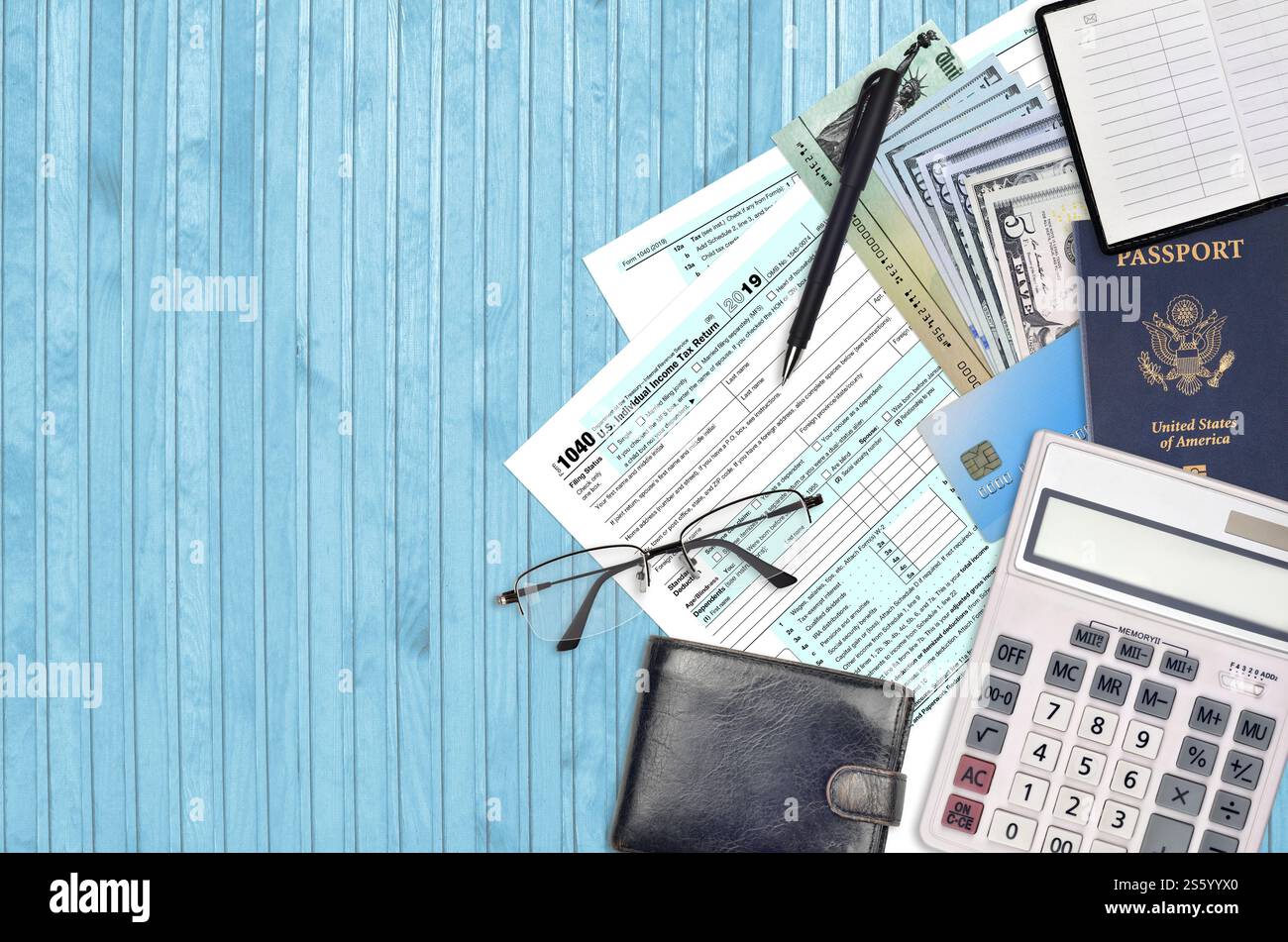 IRS form 1040 U.S. Individual income tax return with refund check lies ...