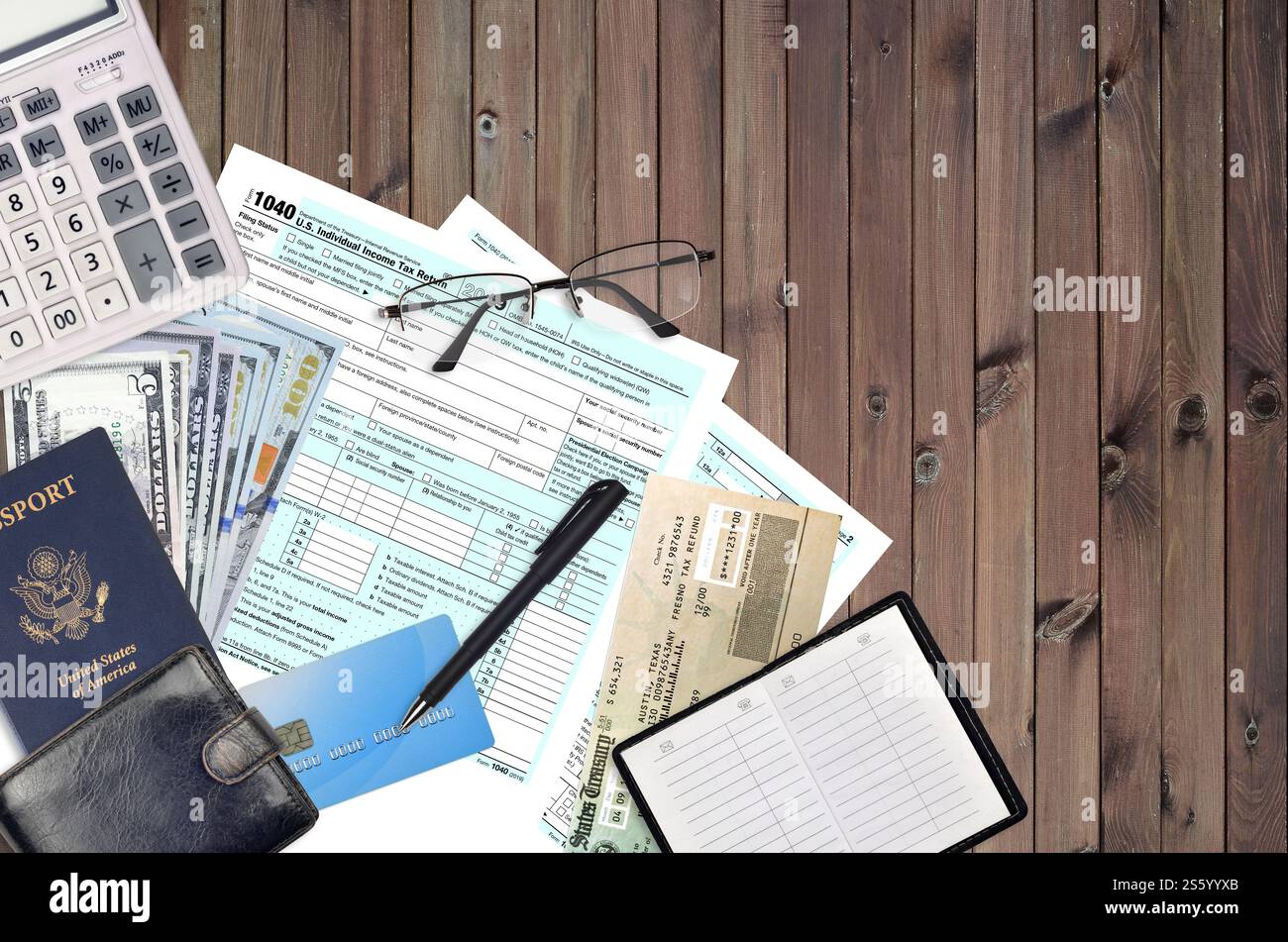 IRS form 1040 U.S. Individual income tax return with refund check lies ...