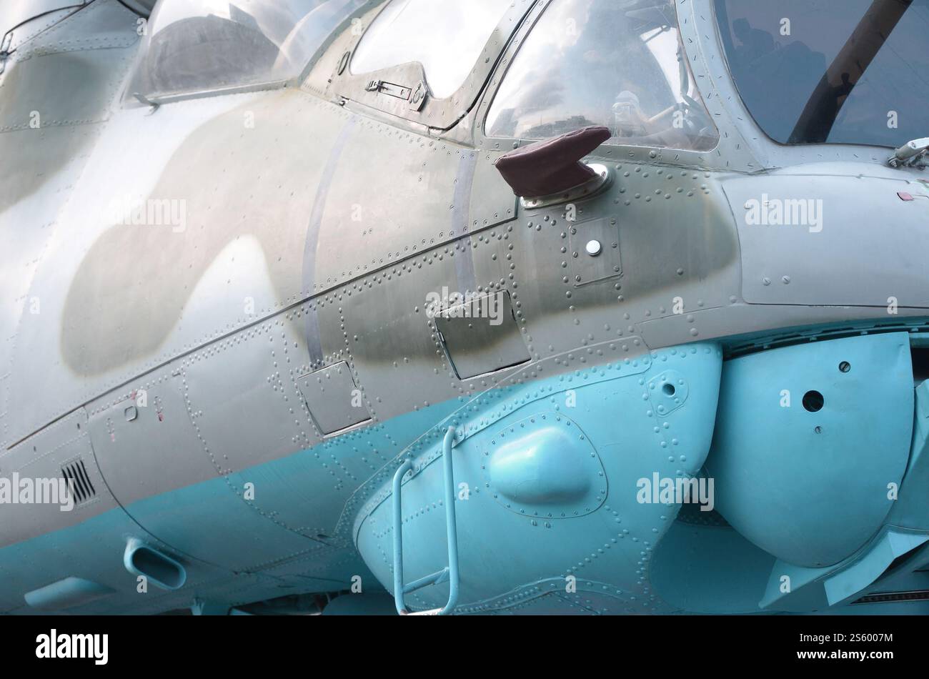 Close up view on helicopter cabin fragment. Camouflage aircraft ...