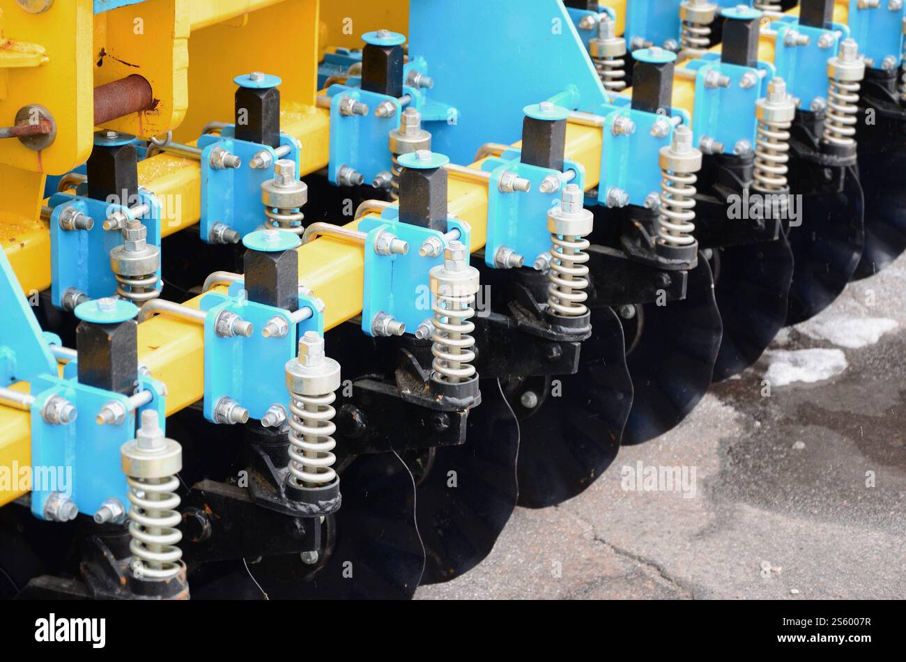 Spring system of agricultural seeder close up. Spring system of ...