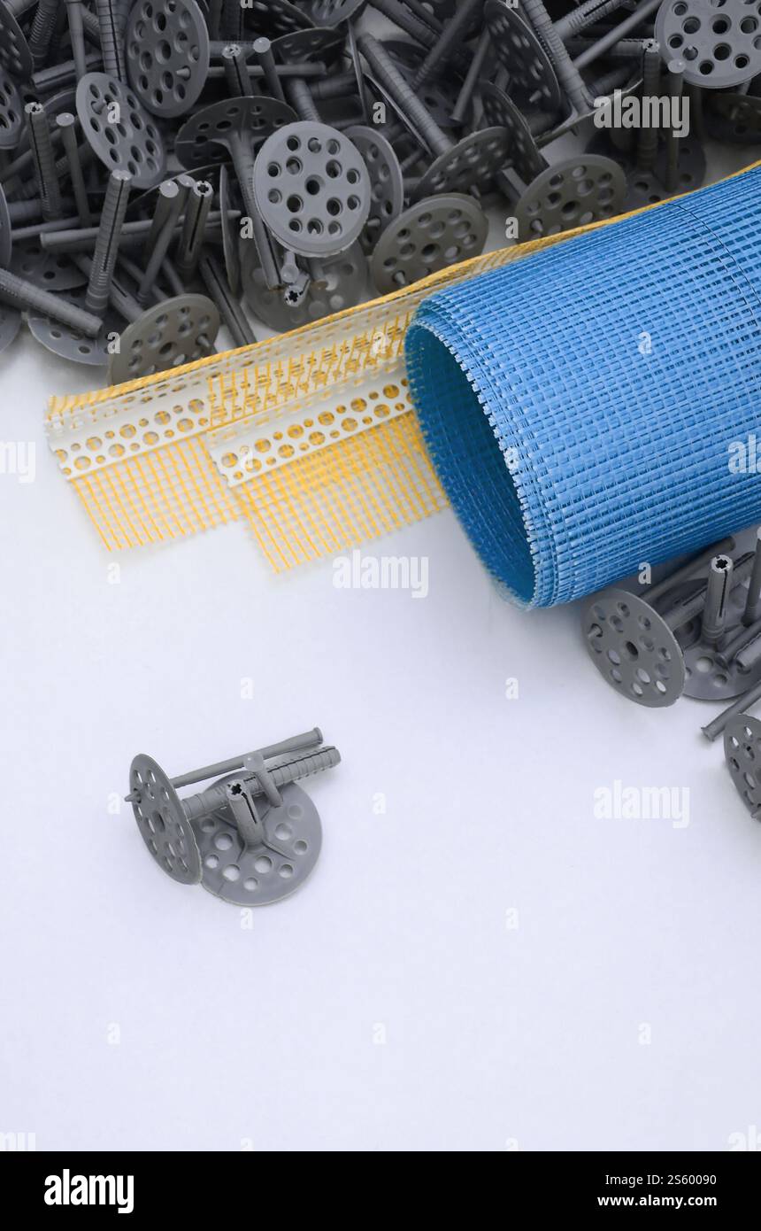 A set of construction items for the insulation of walls. Plastic dowels ...