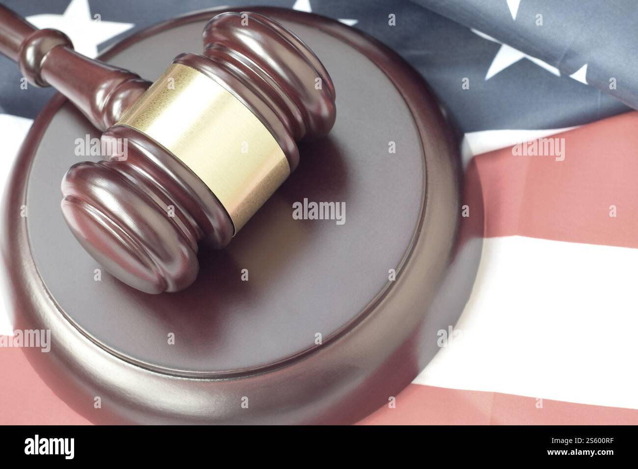 Justice mallet on United States flag in a courtroom during a judicial ...