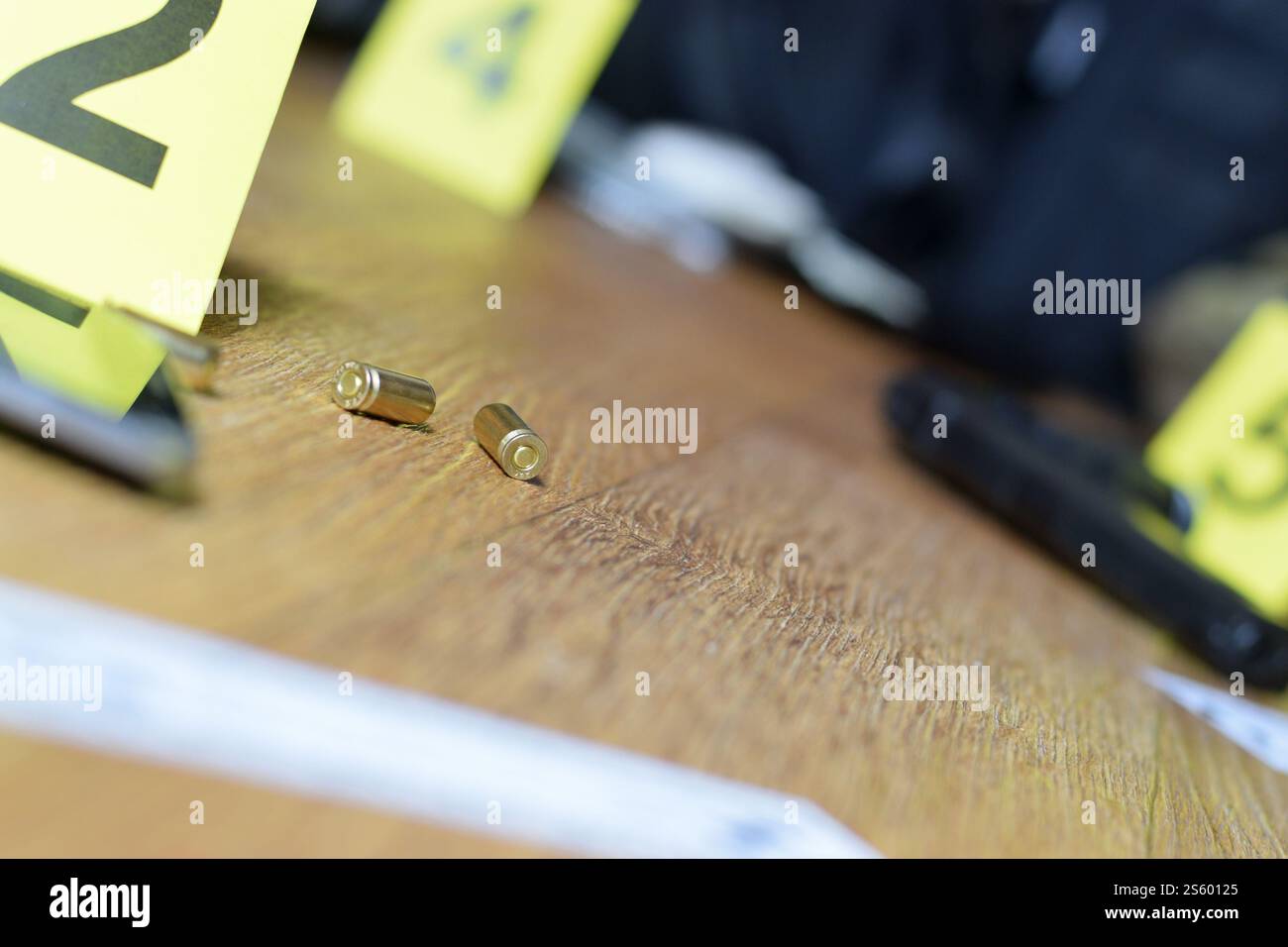 Id tents at crime scene after gunfight indoors. Gun cartridges as ...