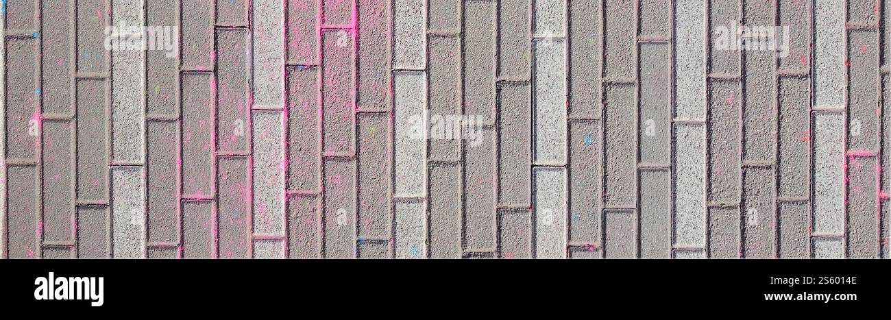 Multi colored earth, paving slabs, powder coated with dry colors at the ...