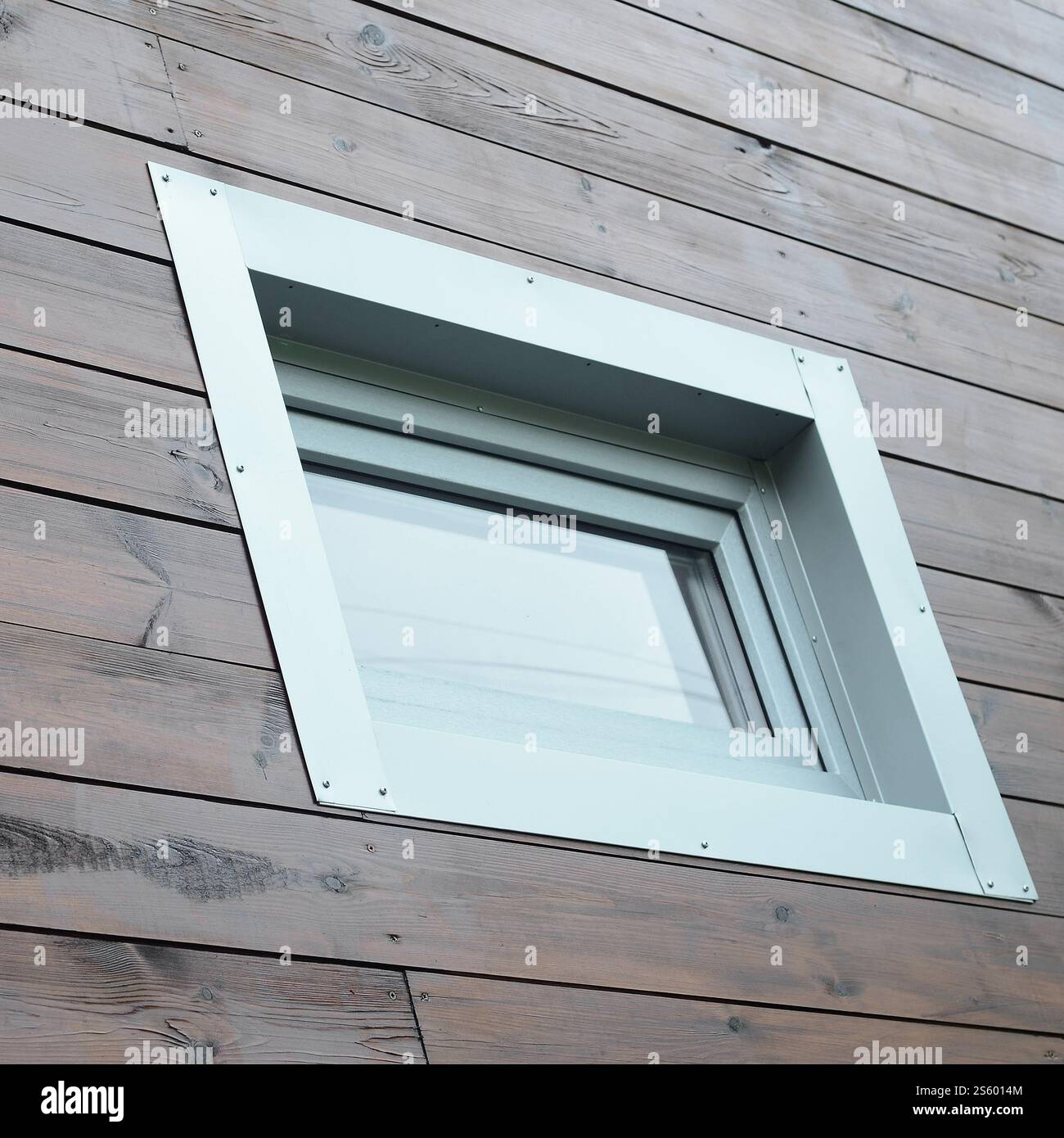 Plastic PVC window in modern passive wooden house facade wall. PVC ...