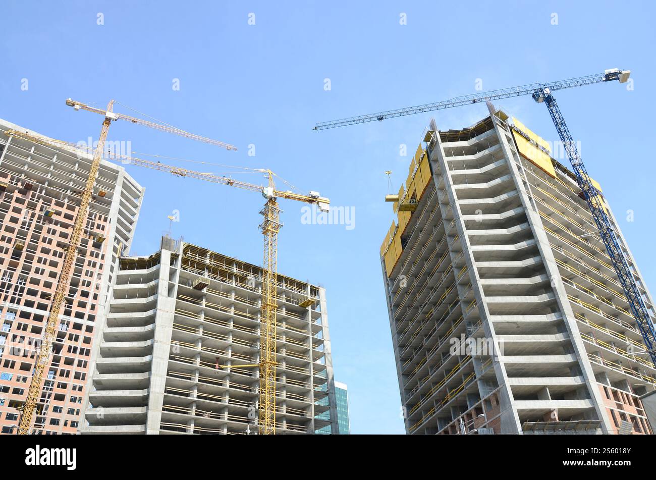 Construction site. High rise multi storey buildings under construction ...