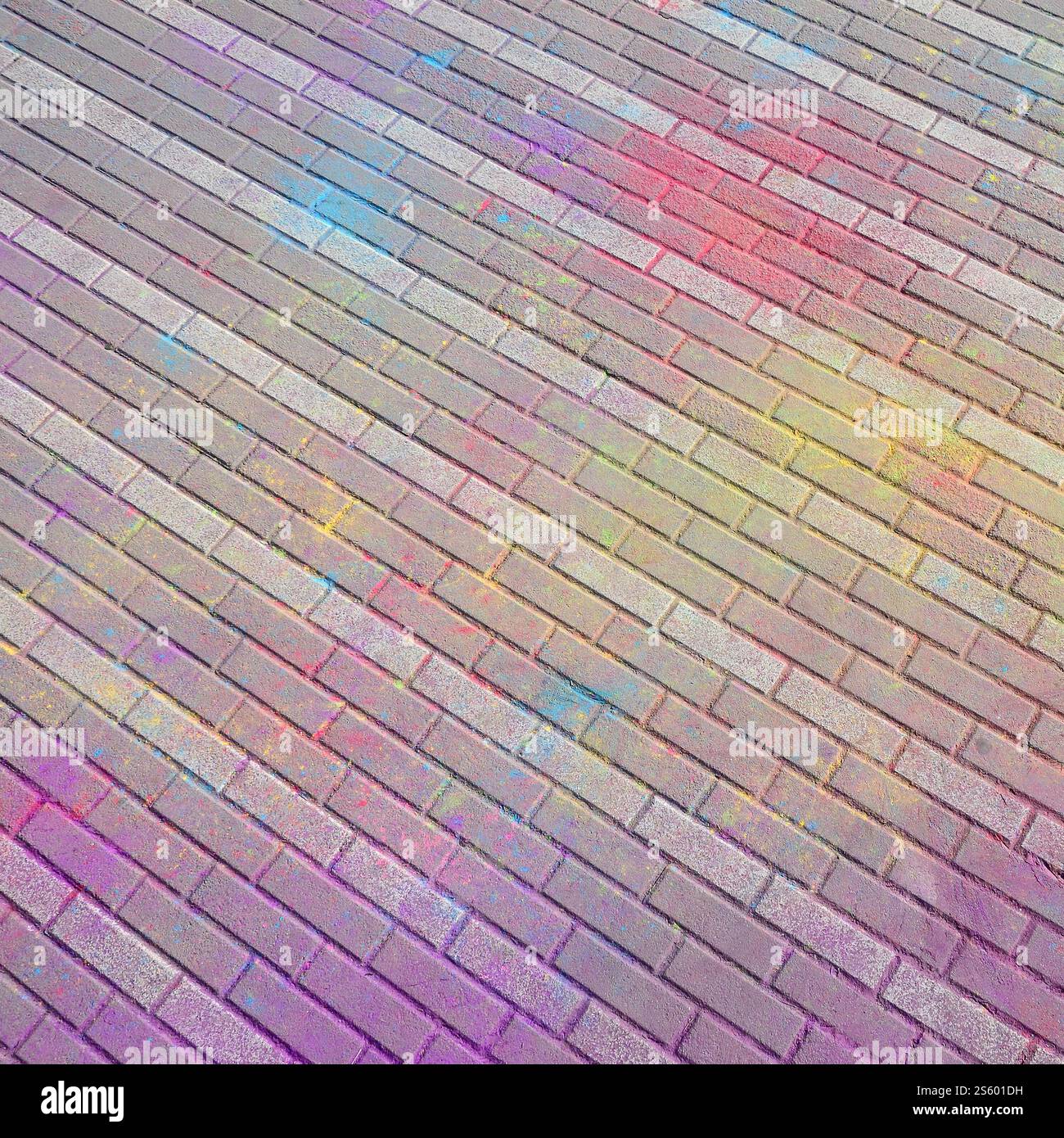 Multi colored earth, paving slabs, powder coated with dry colors at the ...